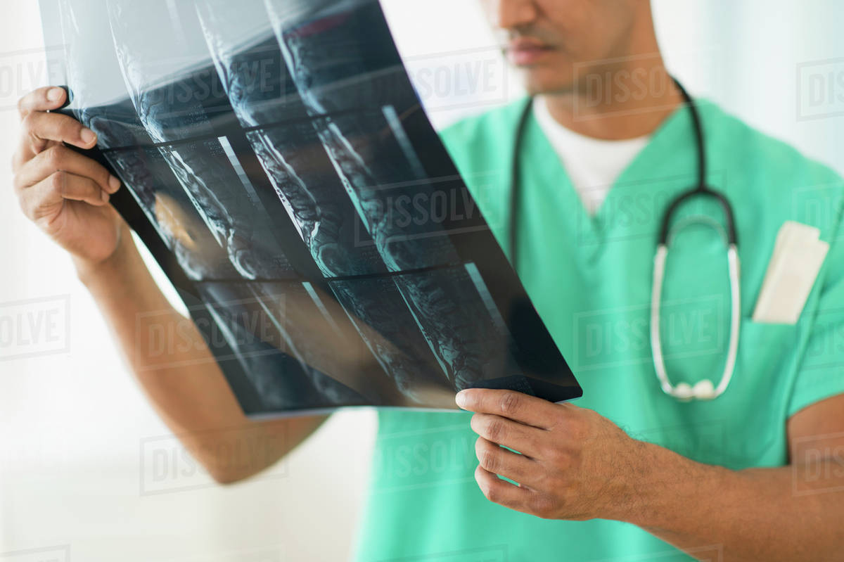 Doctor looking at x-ray image - Royalty-free Stock Photo | Dissolve