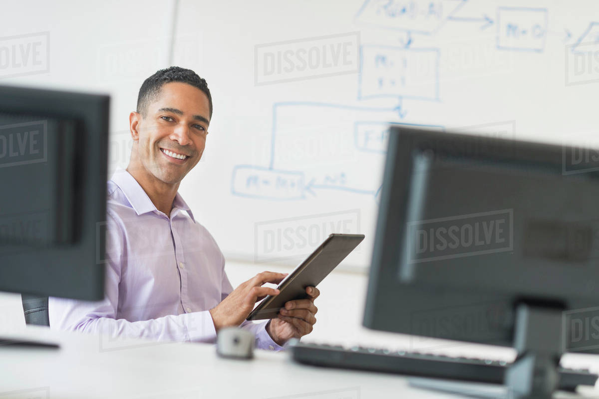 Portrait of male business executive at desk - Royalty-free Stock Photo ...