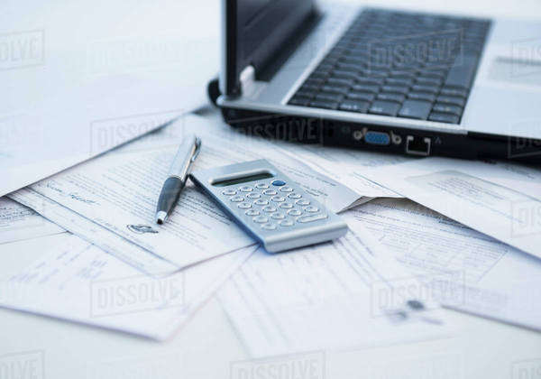 Pen, calculator and laptop - Royalty-free Stock Photo | Dissolve