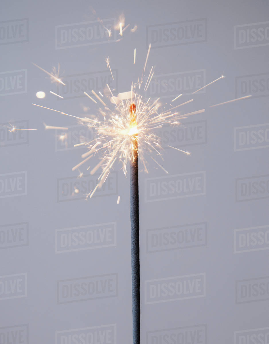 Studio shot of sparkler - Royalty-free Stock Photo | Dissolve