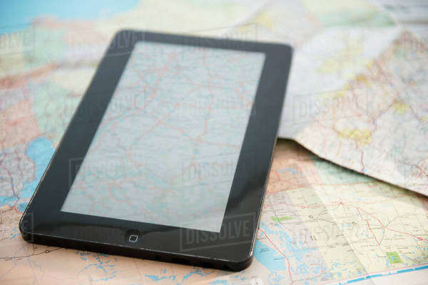 Digital tablet on map - Royalty-free Stock Photo | Dissolve