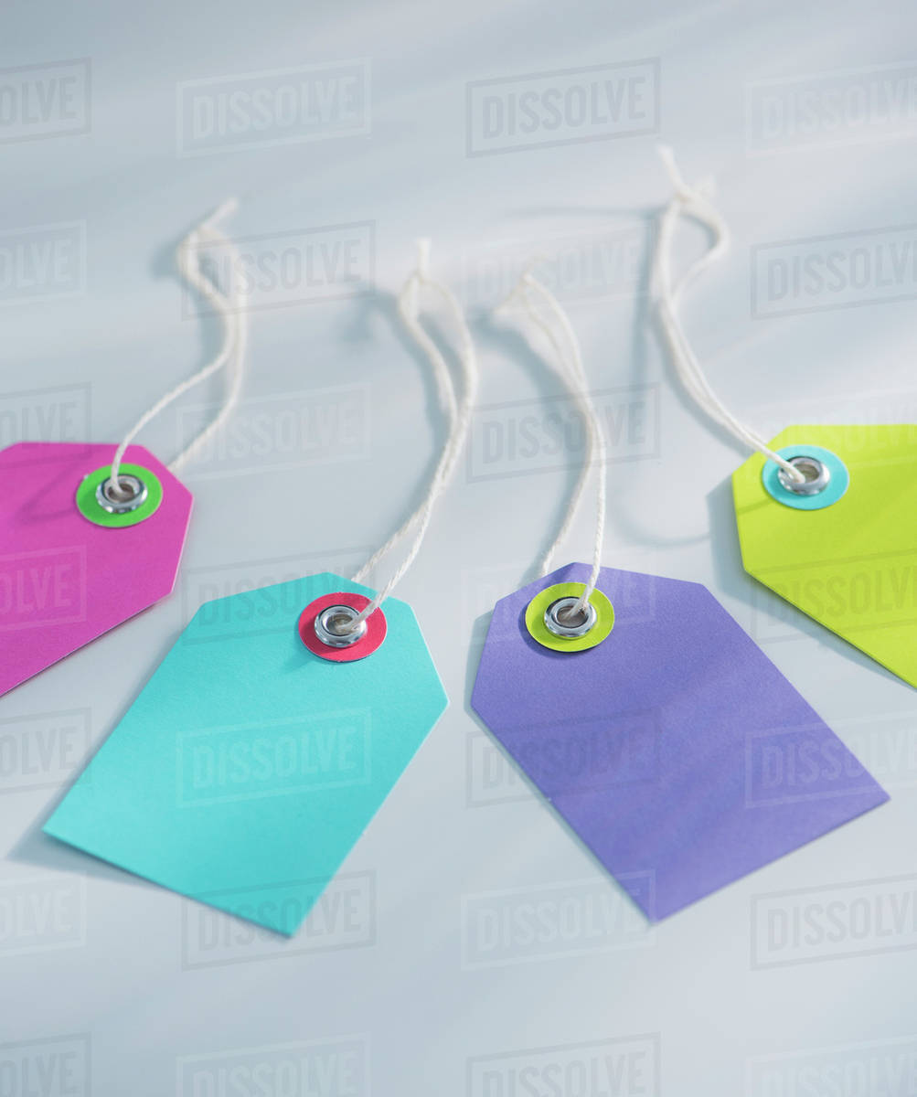 Close up of gift tags with strings - Royalty-free Stock Photo | Dissolve