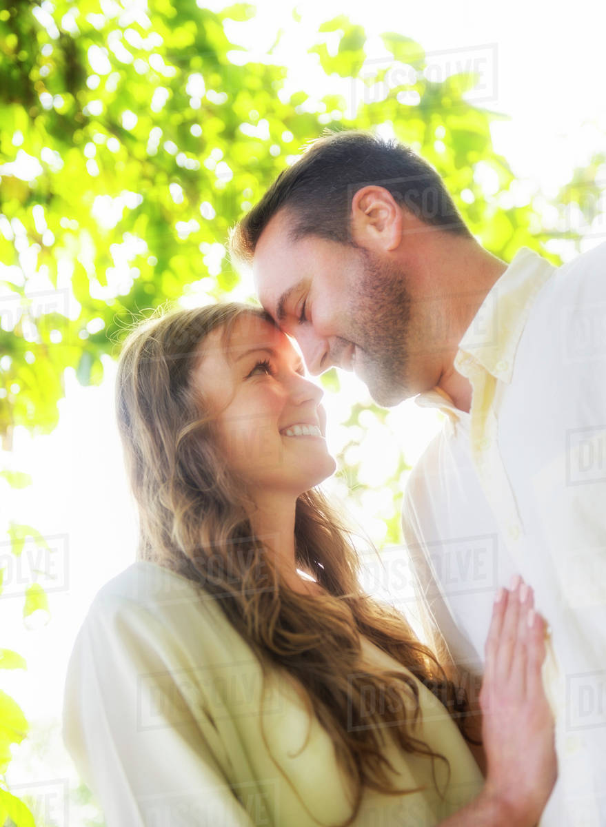 Portrait of flirting couple - Stock Photo - Dissolve