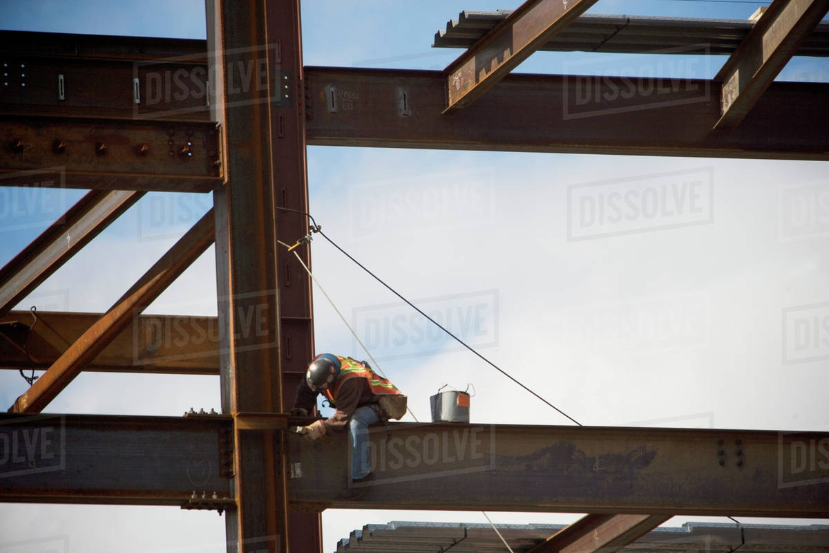 Construction worker working on unfinished structure - Royalty-free ...