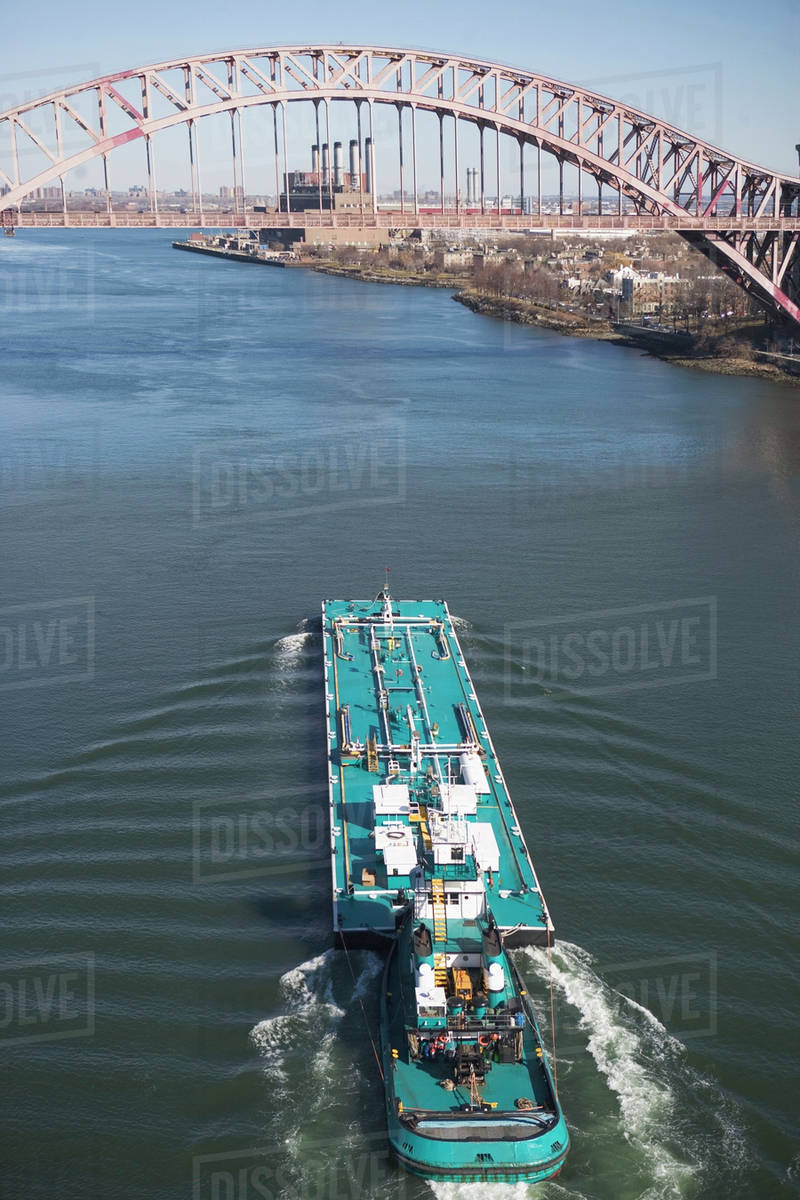 Ship under bridge - Stock Photo - Dissolve