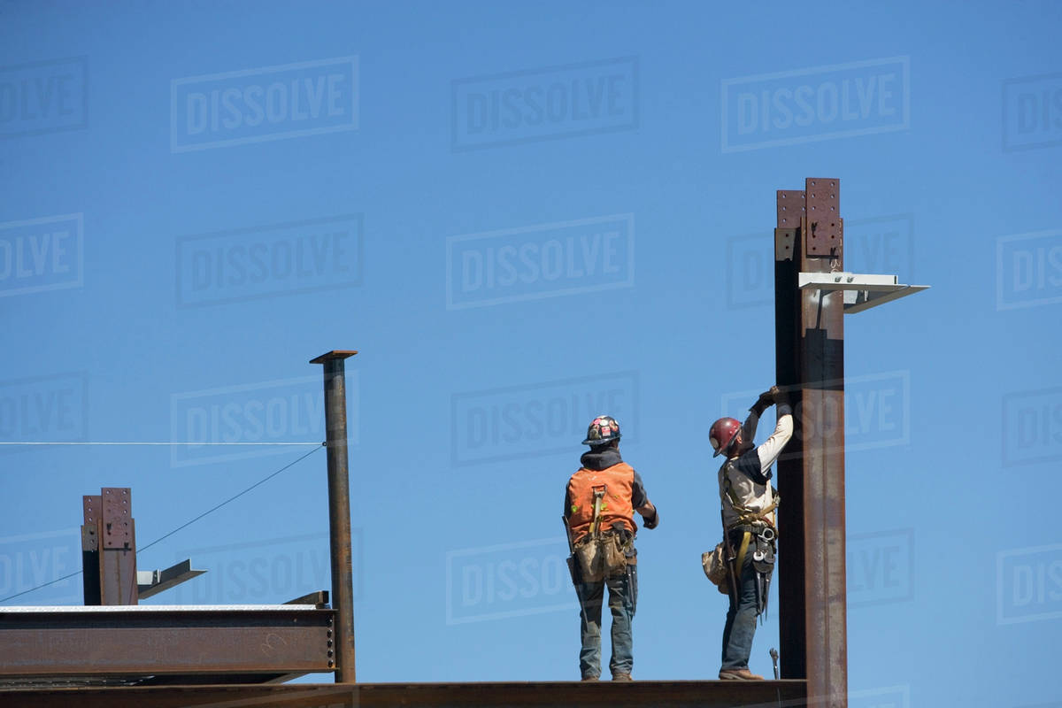Construction workers on construction frame - Royalty-free Stock Photo ...