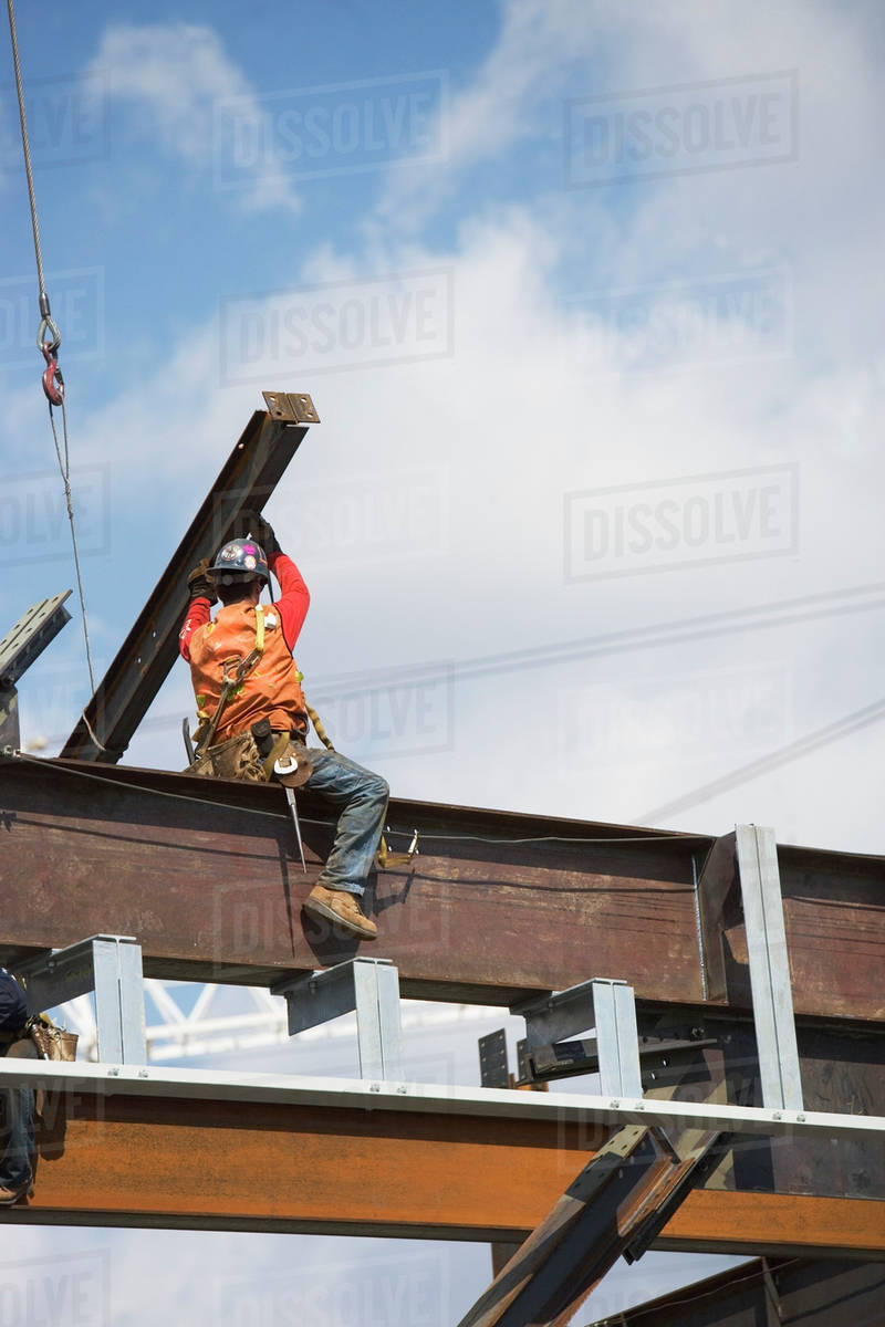 Male worker on construction site - Royalty-free Stock Photo | Dissolve