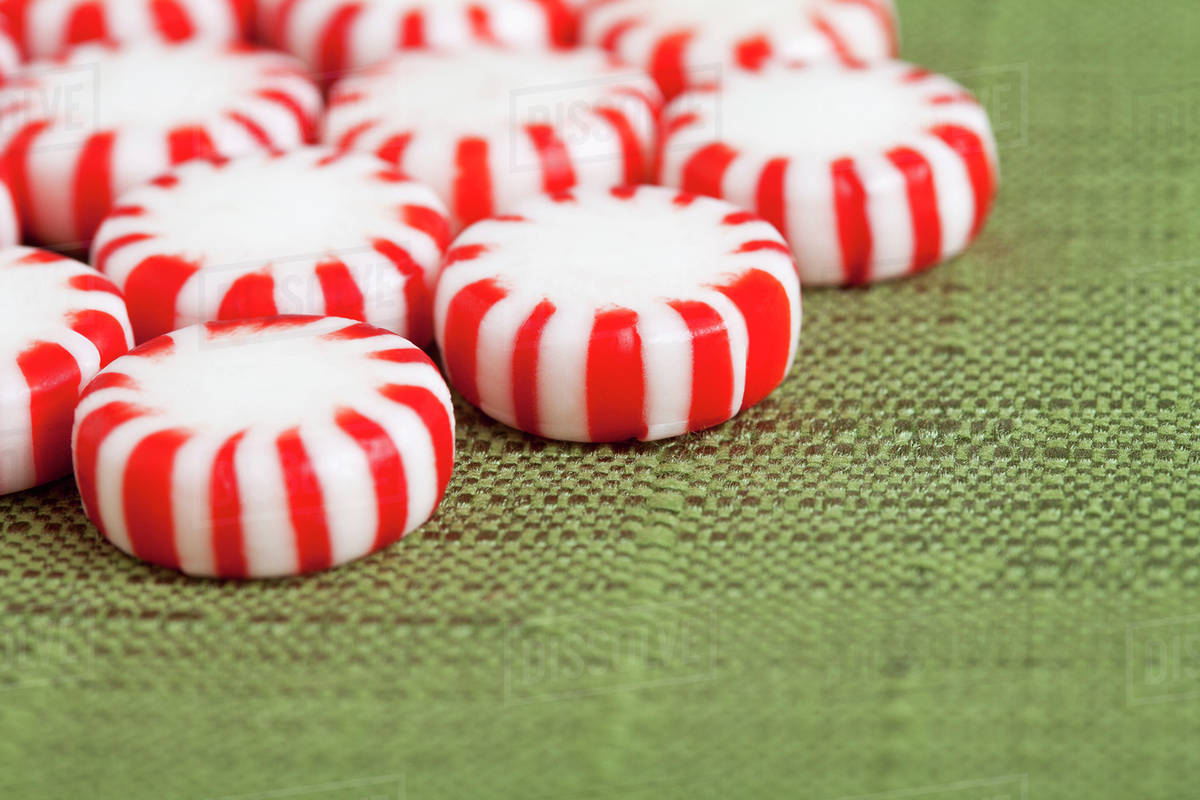 Red and white candies, studio shot - Stock Photo - Dissolve