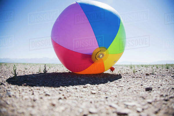 Beach ball in dry field - Royalty-free Stock Photo | Dissolve
