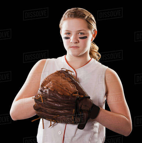 Portrait of girl (12-13) plying softball, studio shot - Stock Photo ...