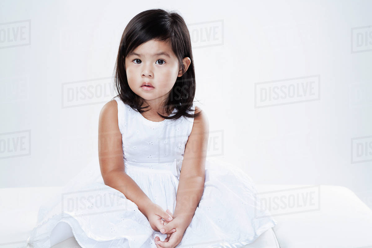 Studio portrait of little girl - Royalty-free Stock Photo | Dissolve