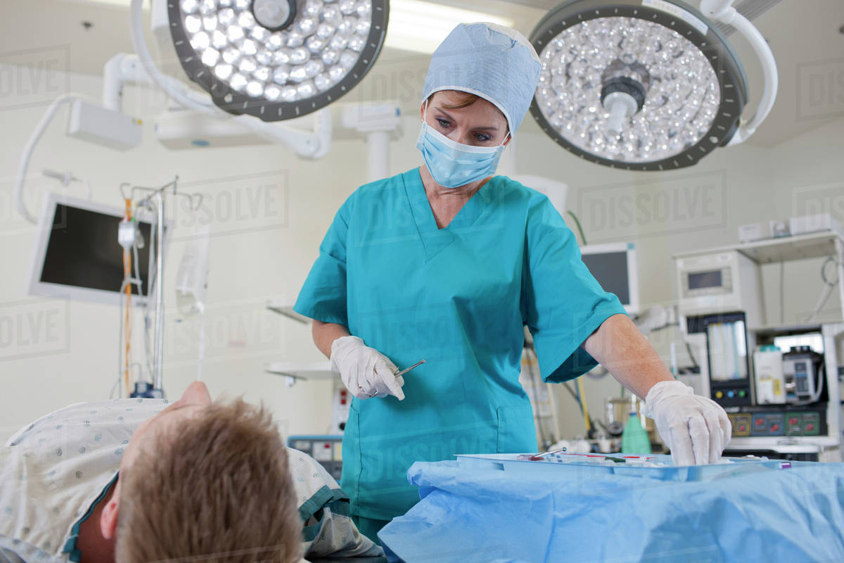 Surgeon preparing patient for surgery - Royalty-free Stock Photo | Dissolve