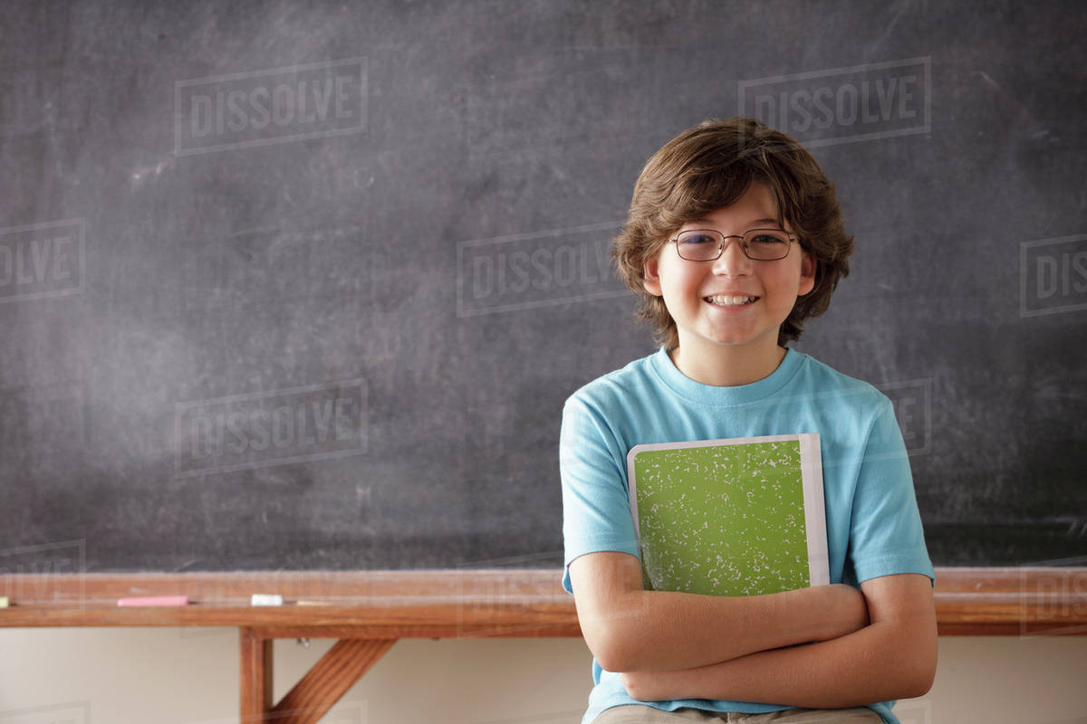 Portrait of schoolboy (10-11) in front of blackboard - Royalty-free ...