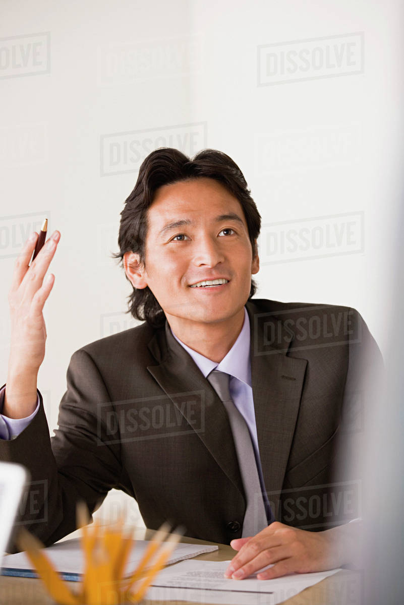 Businessman gesturing - Stock Photo - Dissolve