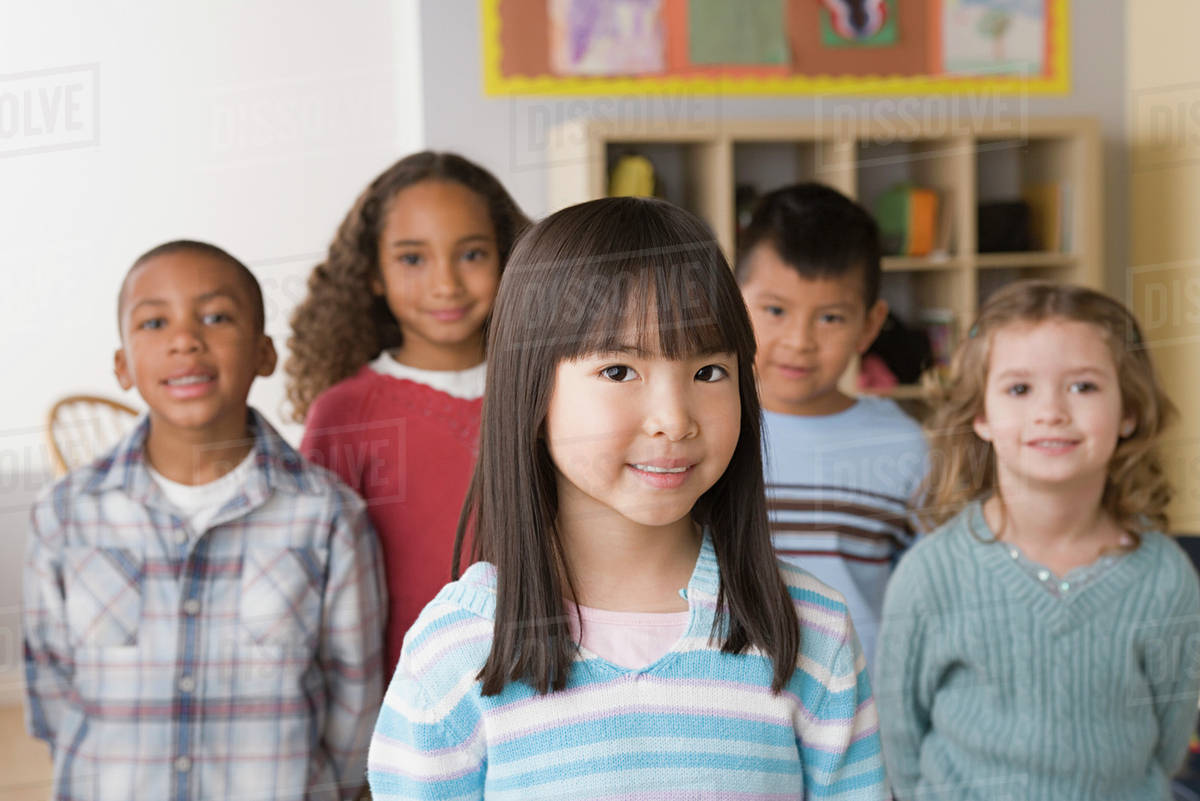 Smiling children (6-7) in classroom - Royalty-free Stock Photo | Dissolve