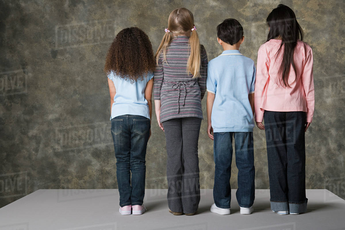 Rear view of children (8-9) standing, studio shot - Royalty-free Stock ...