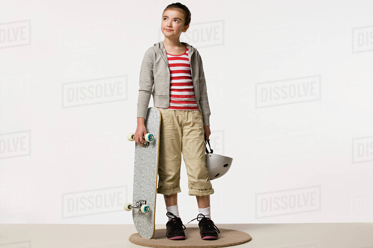 Studio portrait of girl (8-9) with skateboard - Royalty-free Stock ...