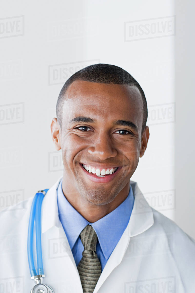 Portrait of smiling male doctor - Royalty-free Stock Photo | Dissolve