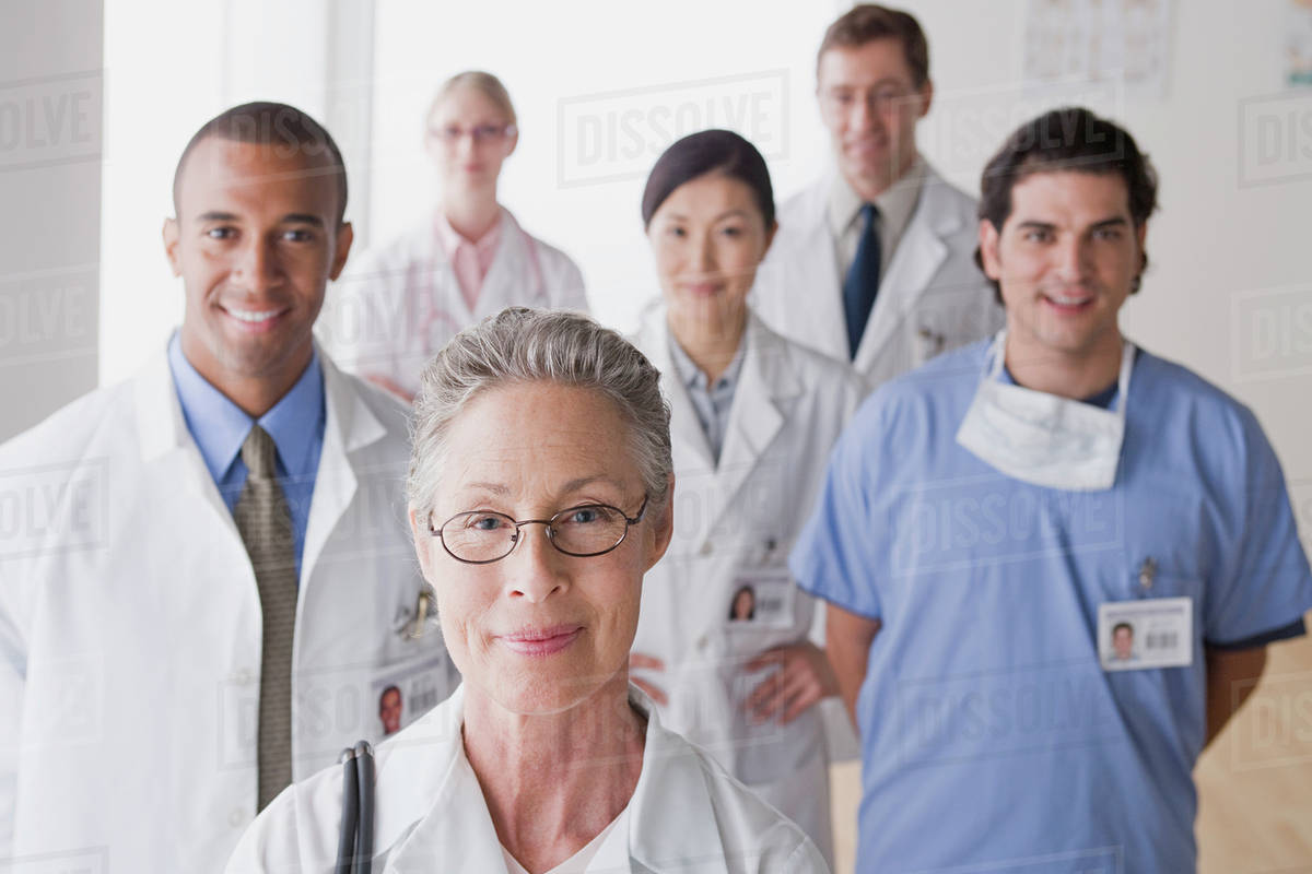 Group portrait of smiling doctors - Stock Photo - Dissolve