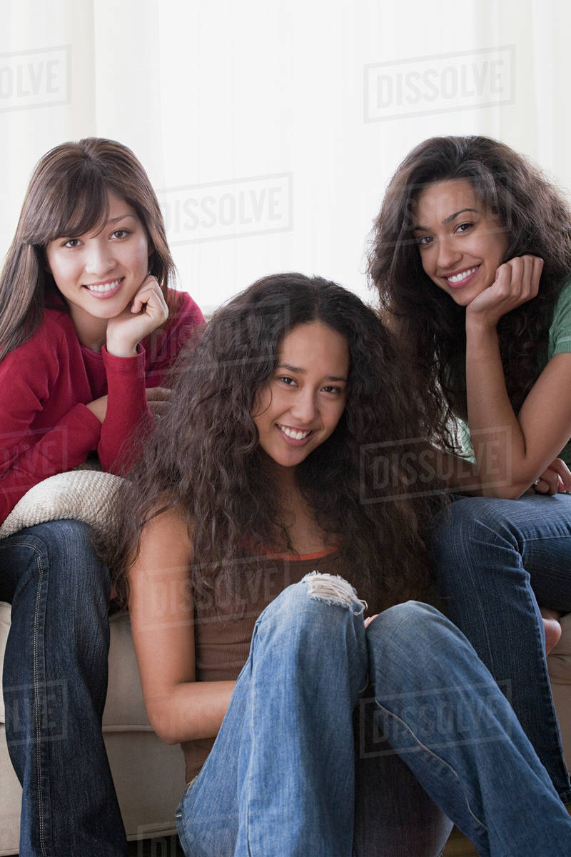 Portrait of three young women smiling - Royalty-free Stock Photo | Dissolve