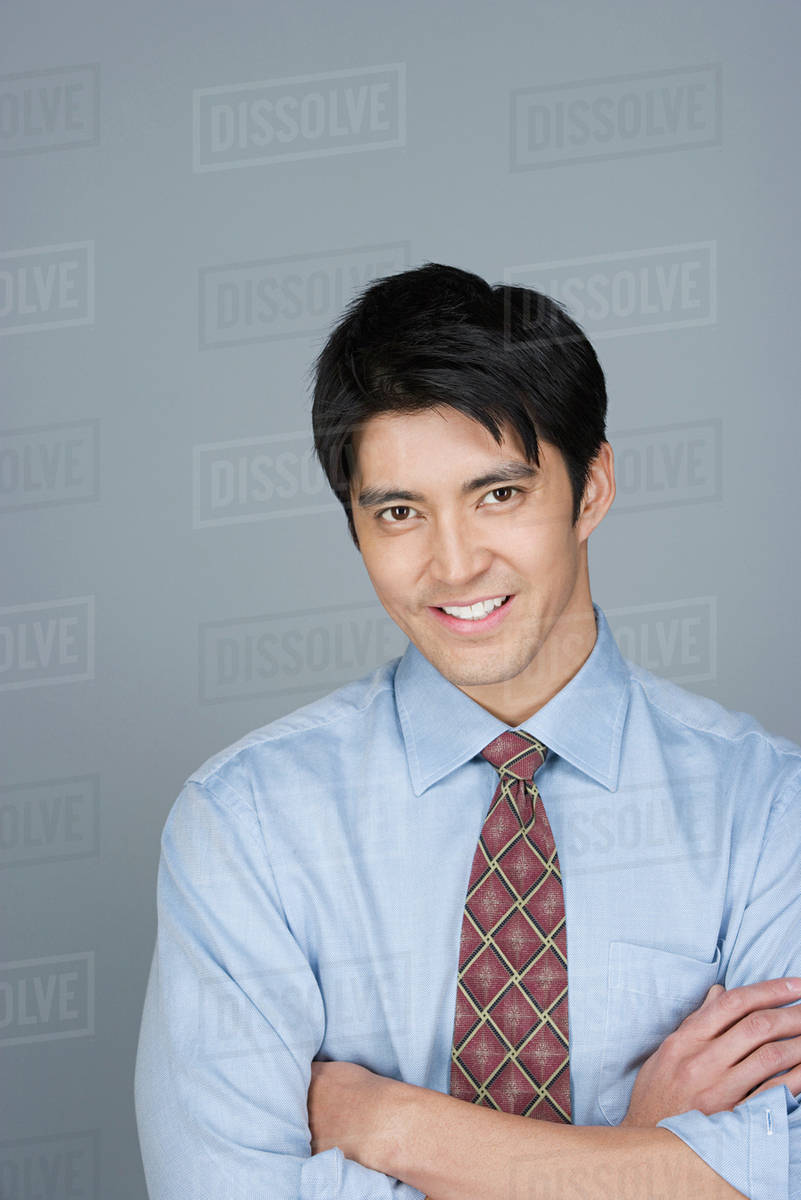 Portrait of happy young businessman - Stock Photo - Dissolve