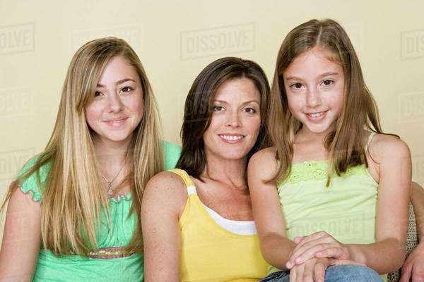 Portrait of happy mother with two girls (8-9, 14-15) - Royalty-free ...