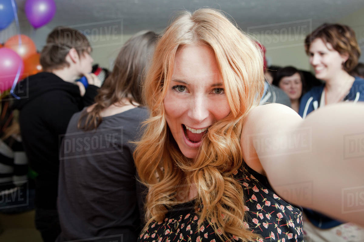 Self portrait of young woman at party - Royalty-free Stock Photo | Dissolve