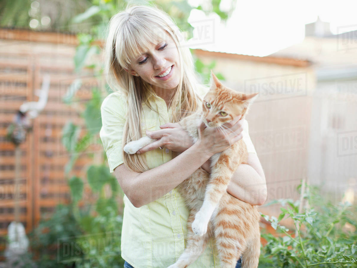 Woman with cat - Stock Photo - Dissolve