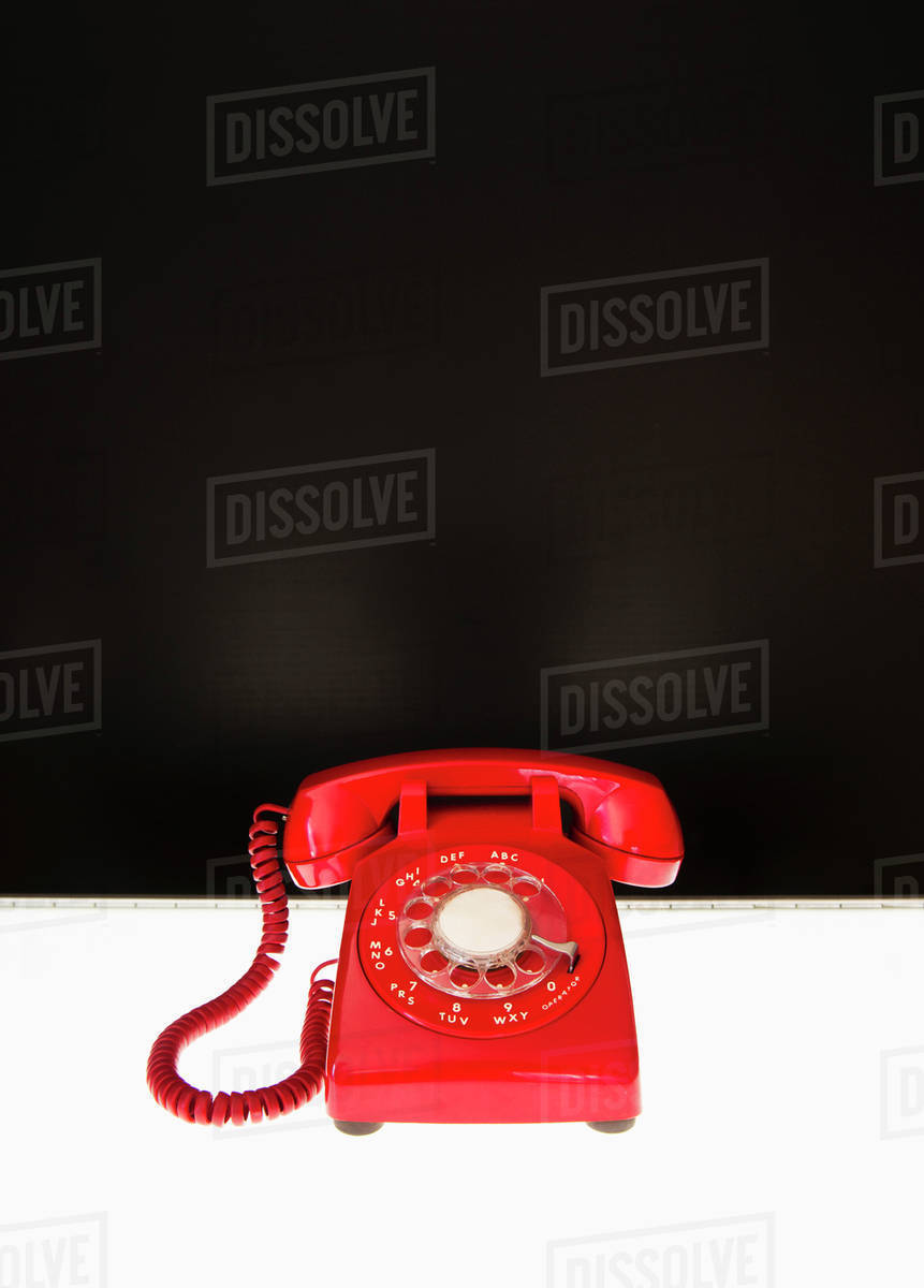 Studio shot of red phone - Royalty-free Stock Photo | Dissolve