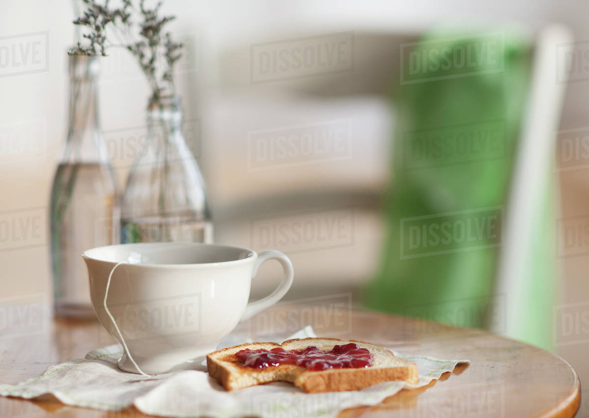 Cup of tea and toast with marmalade - Royalty-free Stock Photo | Dissolve