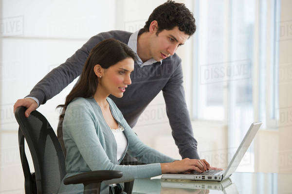 Business man and woman using computer in office - Royalty-free Stock ...