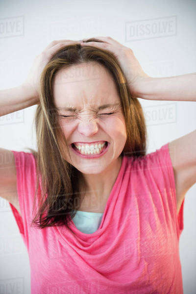 Studio shot of young woman in distress - Royalty-free Stock Photo ...