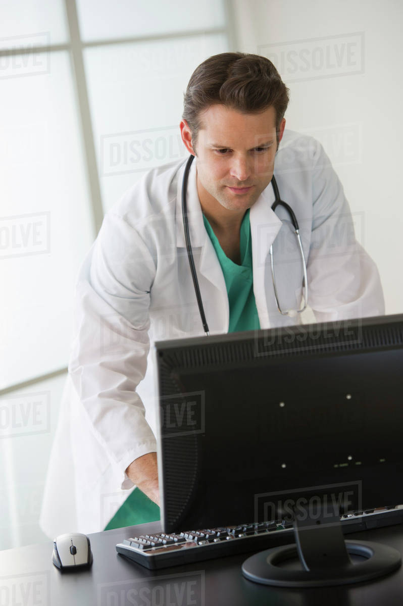 Doctor working on computer - Royalty-free Stock Photo | Dissolve