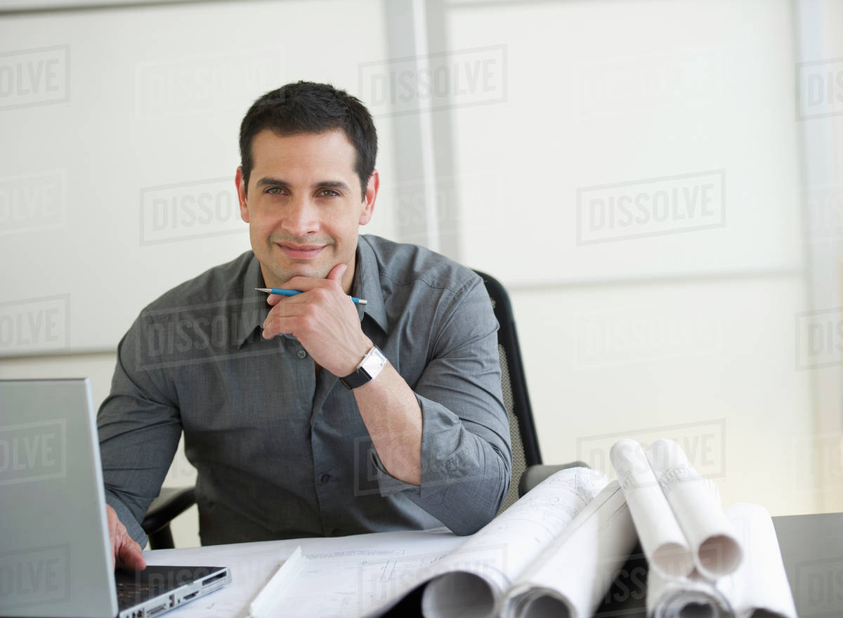 Portrait of architect using laptop - Royalty-free Stock Photo | Dissolve