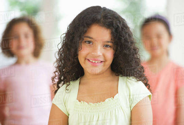 Portrait of girl (8-9) with friends - Royalty-free Stock Photo | Dissolve