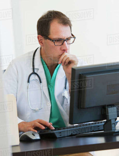 Doctor using computer - Royalty-free Stock Photo | Dissolve