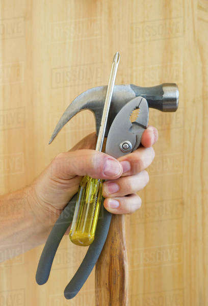 Hand holding tools - Stock Photo - Dissolve