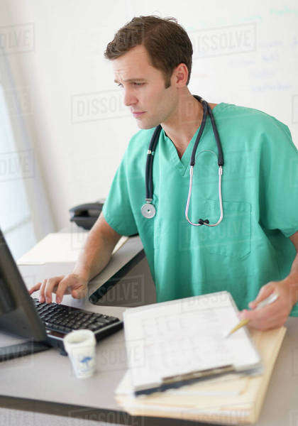 Doctor using computer - Royalty-free Stock Photo | Dissolve