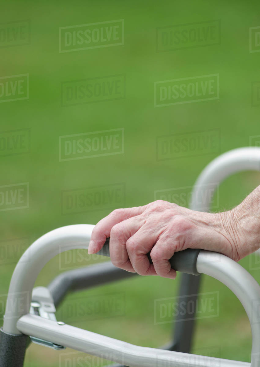 Senior walking with walker, close-up of hands - Royalty-free Stock ...
