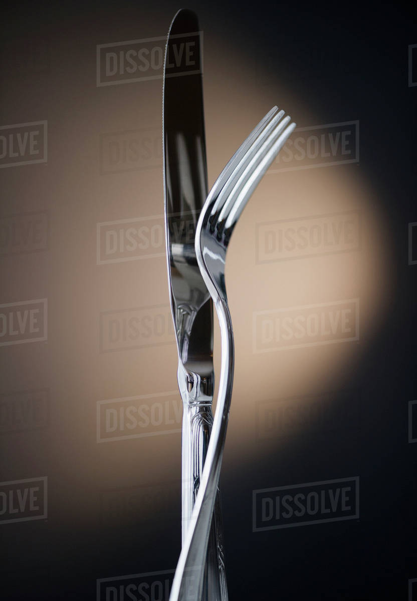 Close up of fork and knife on black background - Royalty-free Stock ...