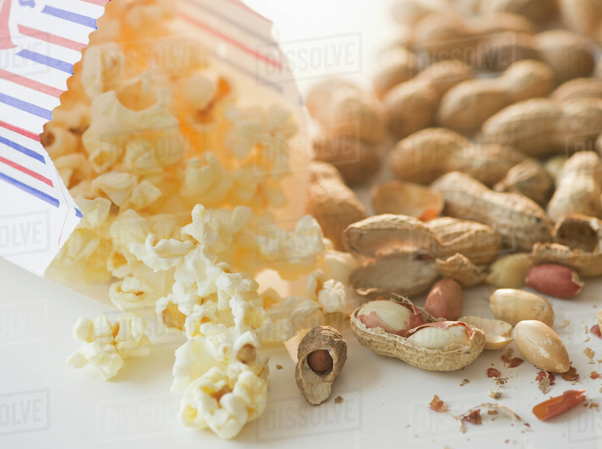 Close up of popcorn and peanuts - Royalty-free Stock Photo | Dissolve