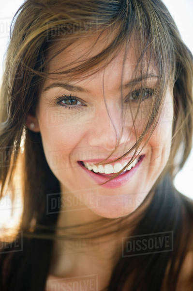 Portrait of smiling woman - Royalty-free Stock Photo | Dissolve