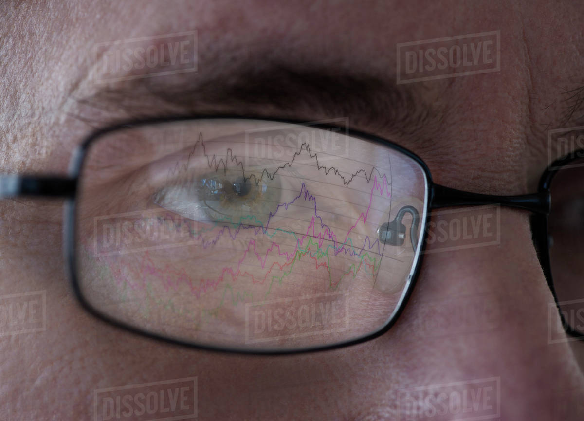 Close-up of man's eye with graph reflecting in glasses - Royalty-free ...