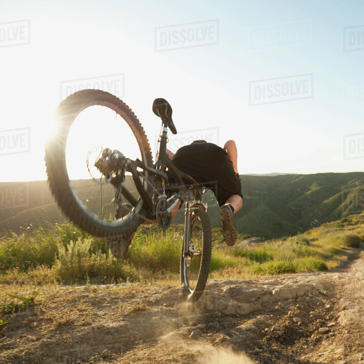 USA, California, Laguna Beach, Mountain biker falling of his bike ...