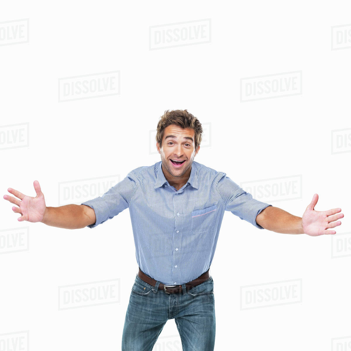 Studio shot of young cheerful man with arms outstretched - Stock Photo ...
