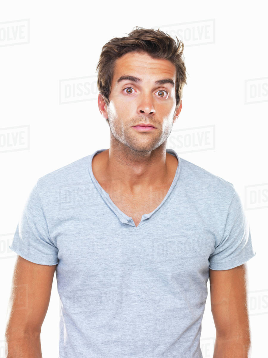 Studio portrait of man with eyes wide open - Royalty-free Stock Photo ...