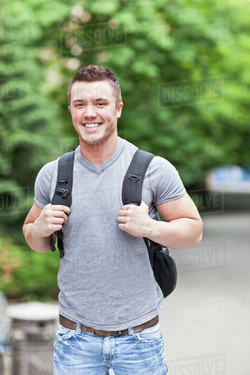 Portrait of male college student smiling - Royalty-free Stock Photo ...