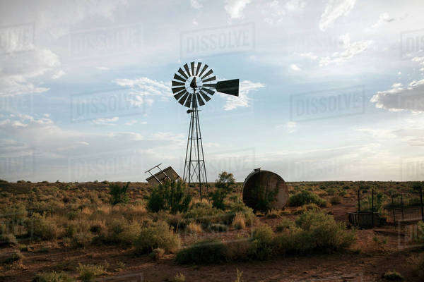 Old farm with windmill - Stock Photo - Dissolve
