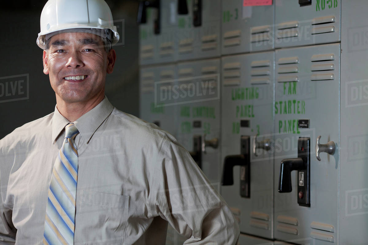 Portrait of male technician wearing hardhat - Royalty-free Stock Photo ...