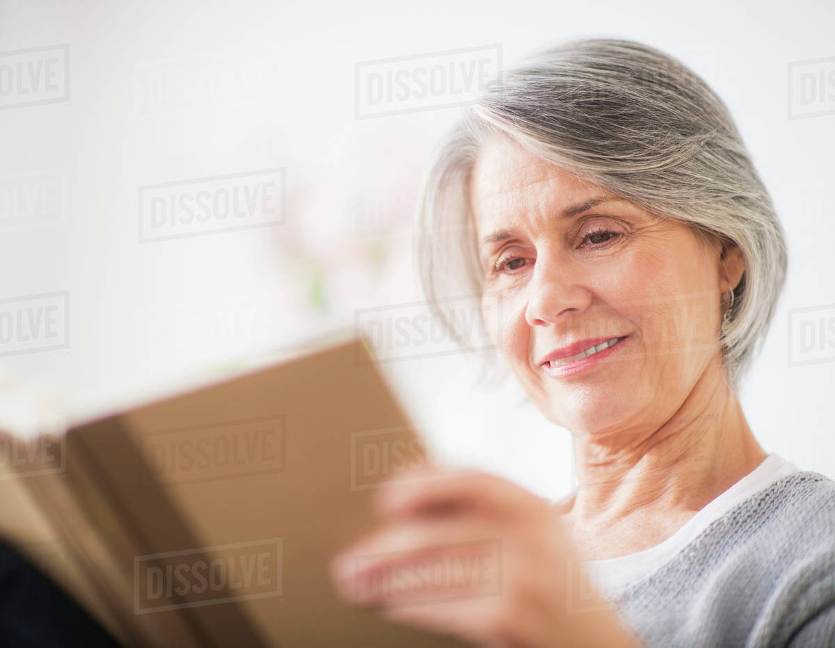 Portrait of woman reading - Royalty-free Stock Photo | Dissolve